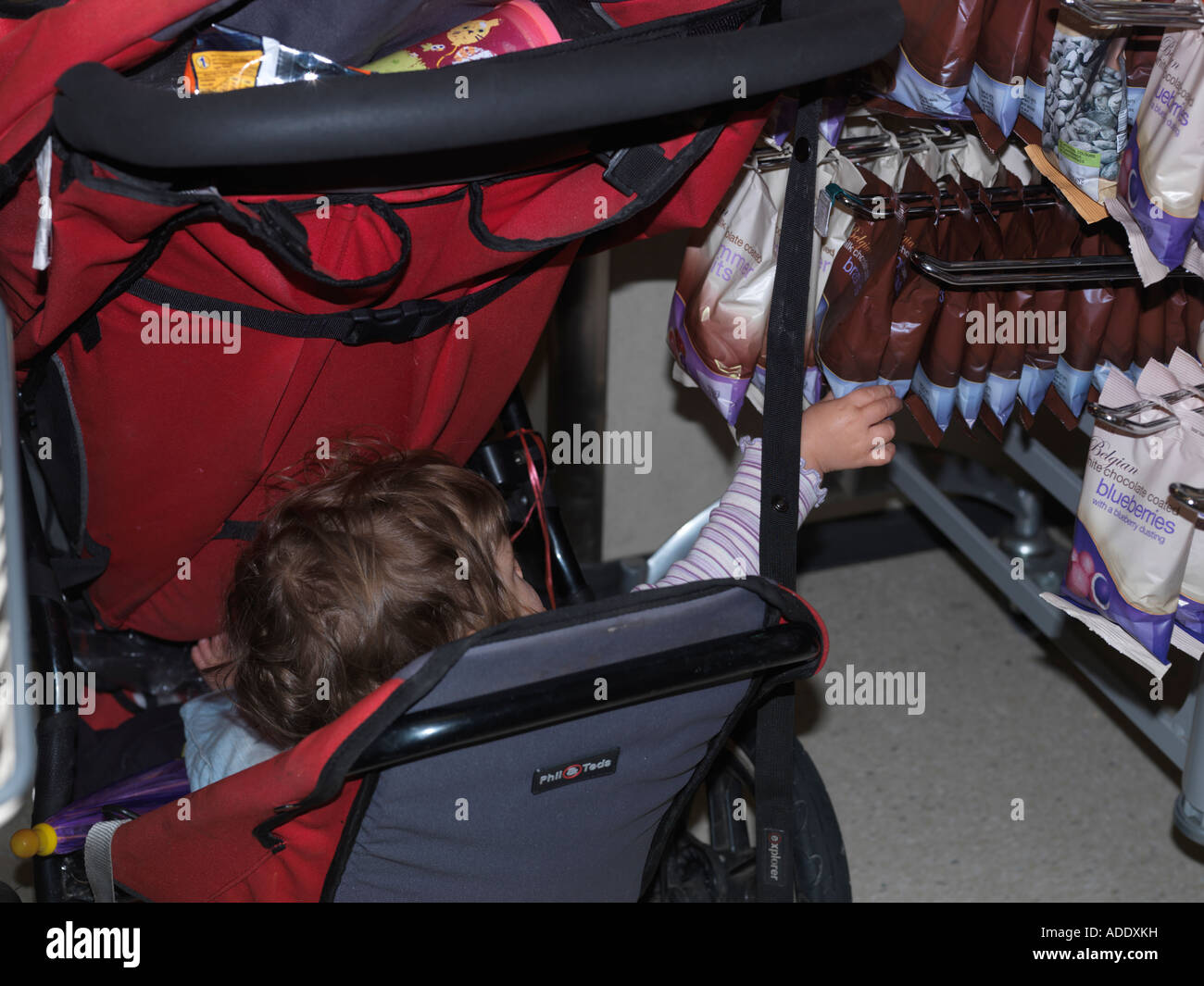 Child At Supermarket Checkout High Resolution Stock Photography and ...