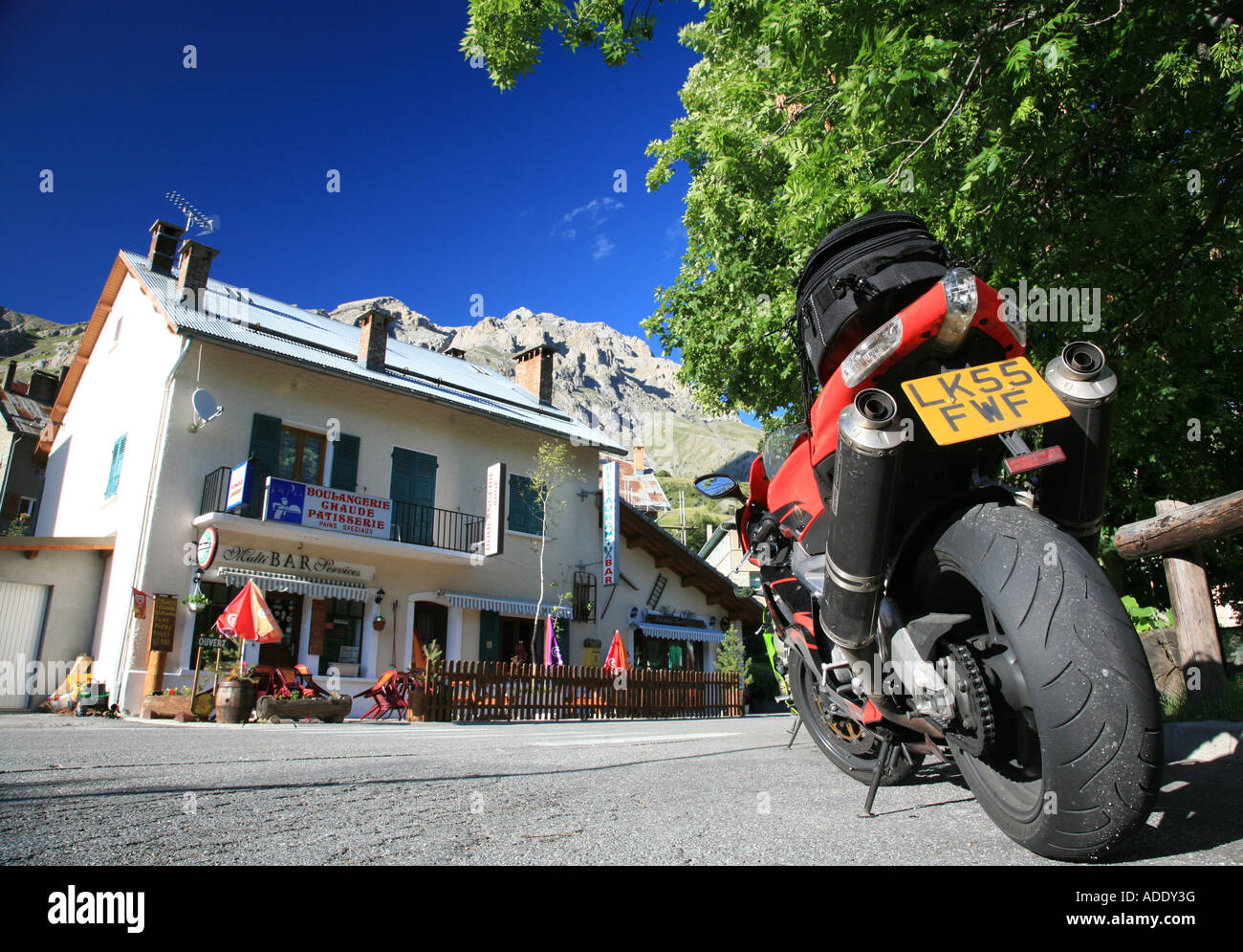 Motorbike parked outside cafe in French Alps Stock Photo - Alamy
