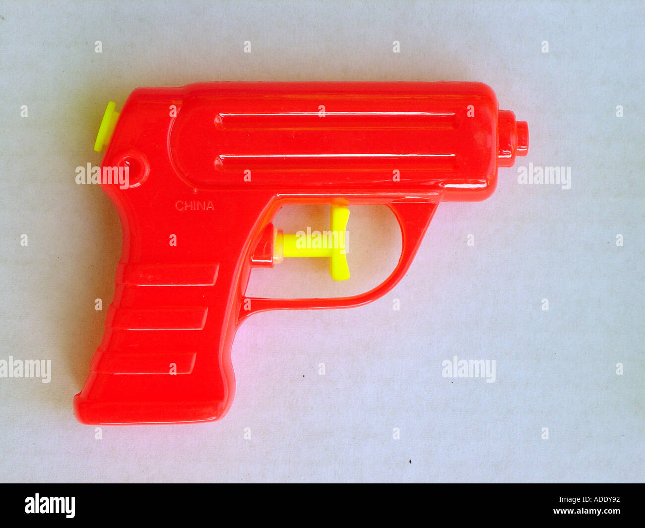 Still Life of a Red Plastic Water Gun Squirt Gun Stock Photo - Alamy