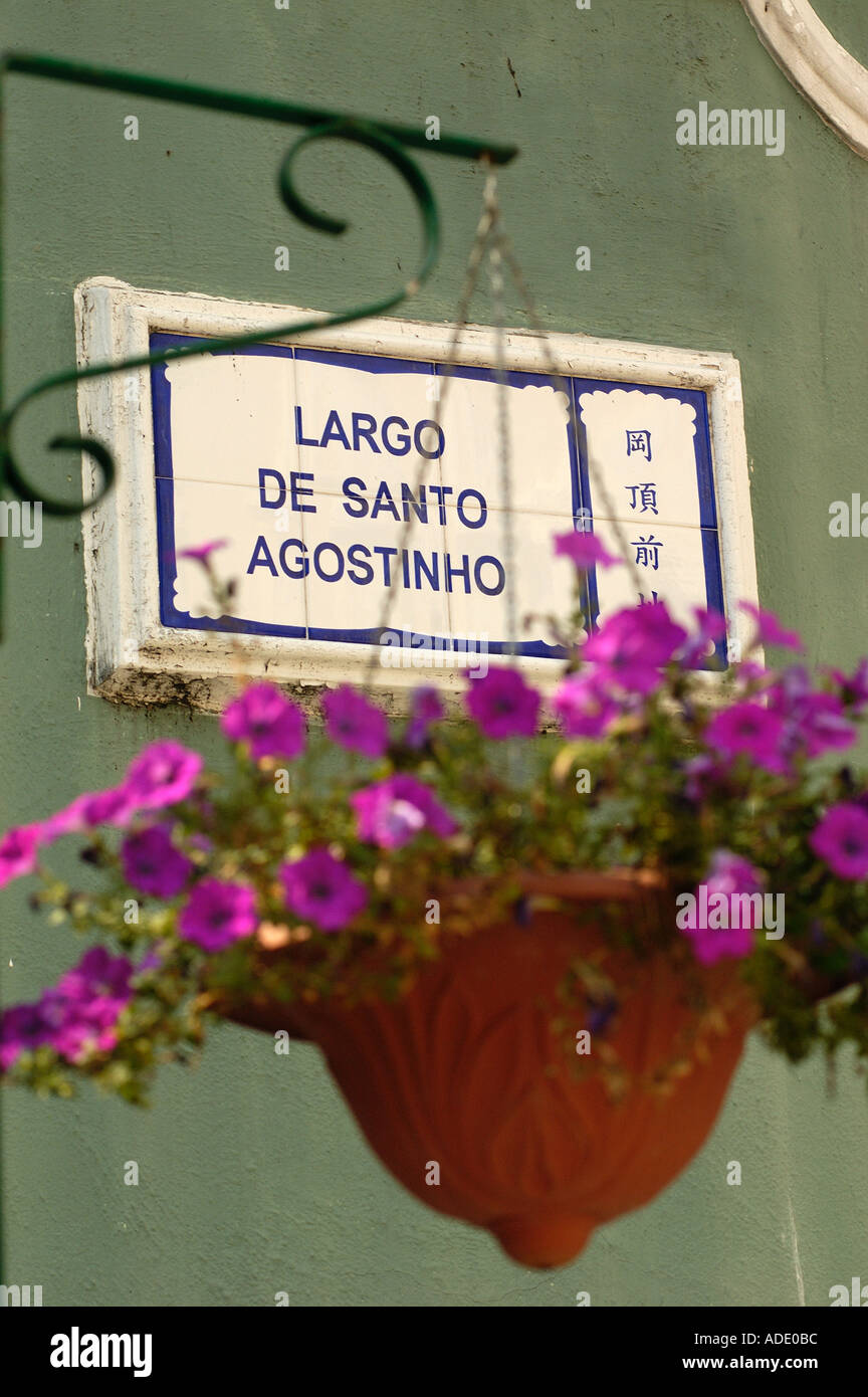 A detail of Macau street architecture of street sign and hanging ...