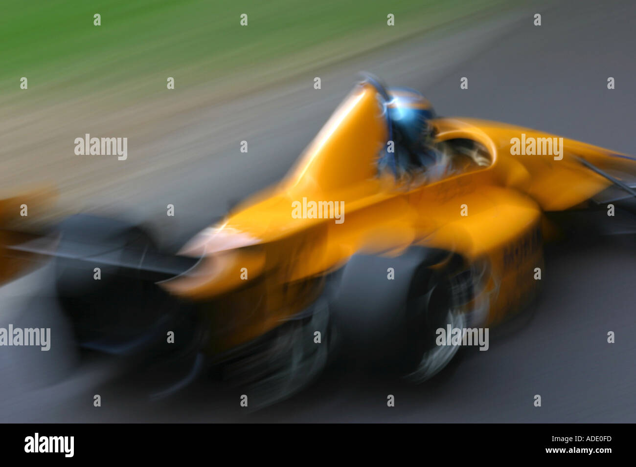 Blurred racing car Stock Photo - Alamy