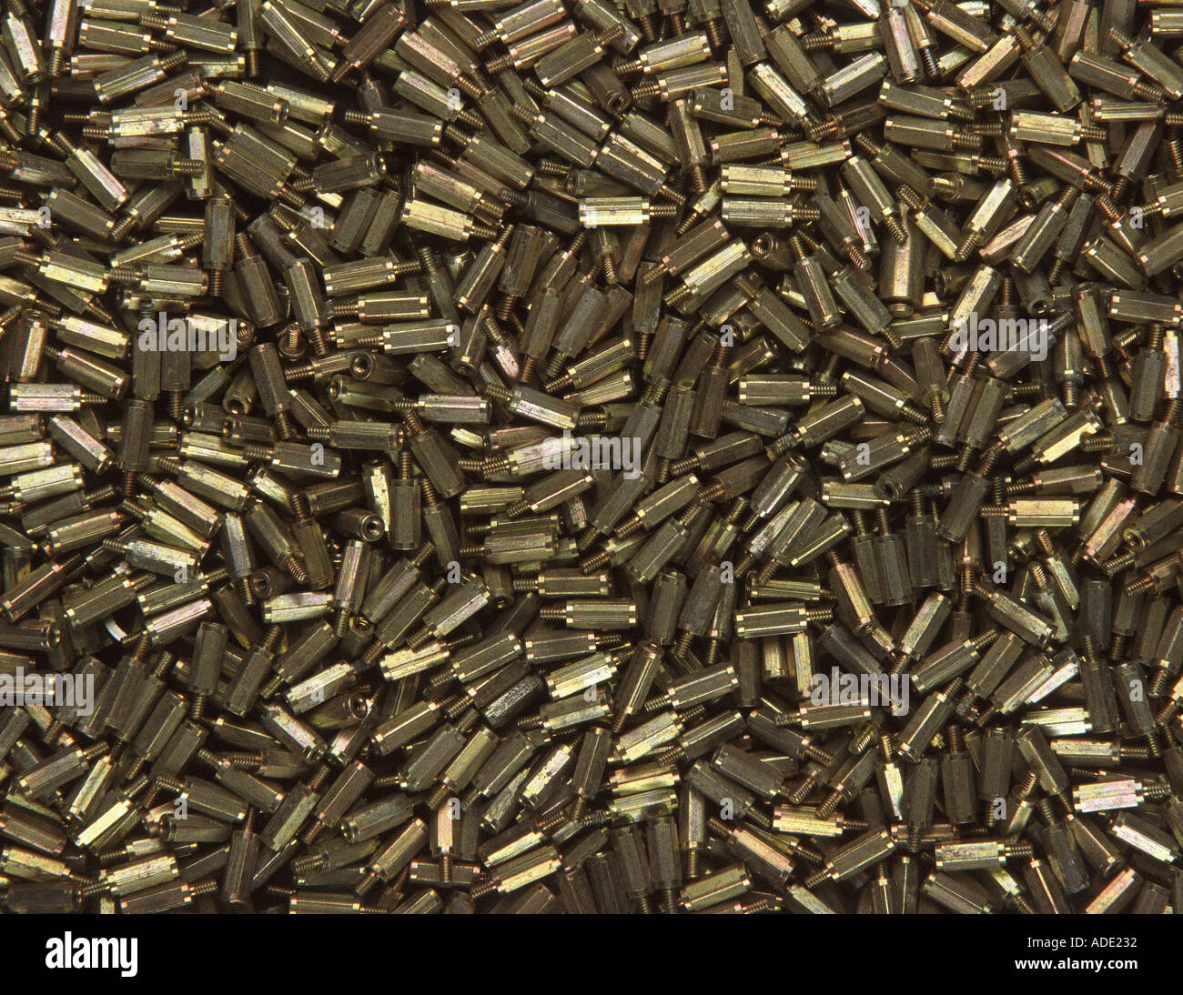 A random collage or background of small shiny gold colored industrial ...