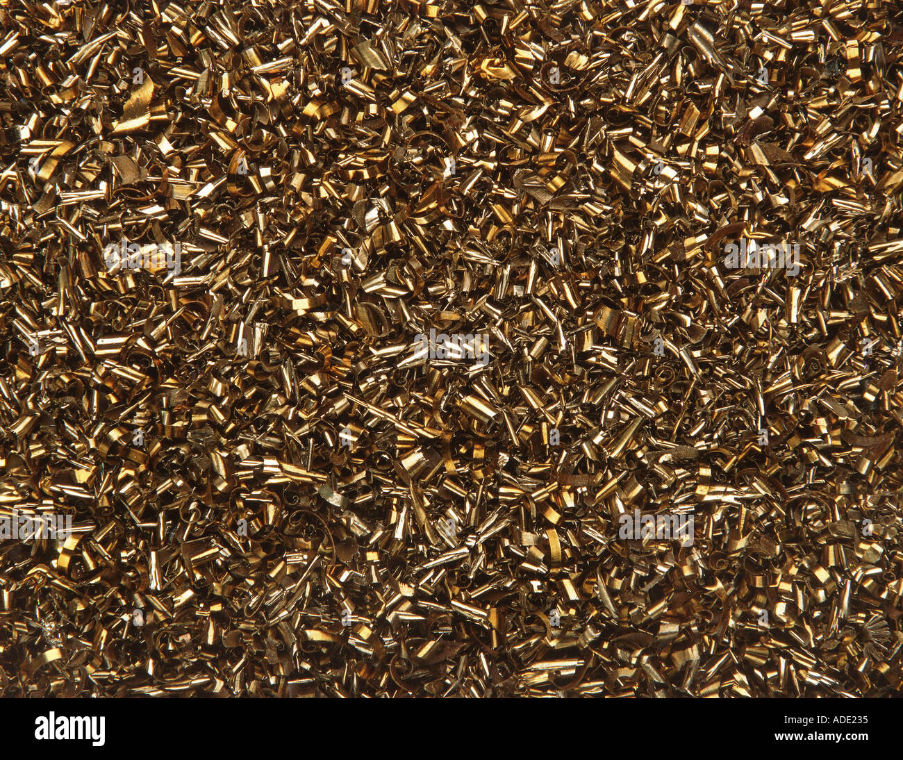 A random collage or background of shiny sharp gold and copper colored ...