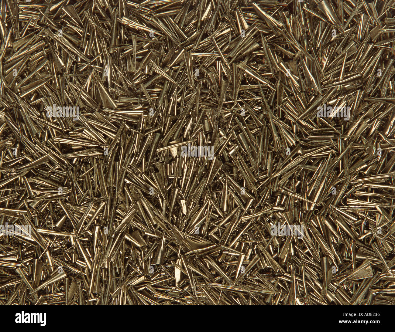 A random collage or background of shiny sharp gold and copper colored ...