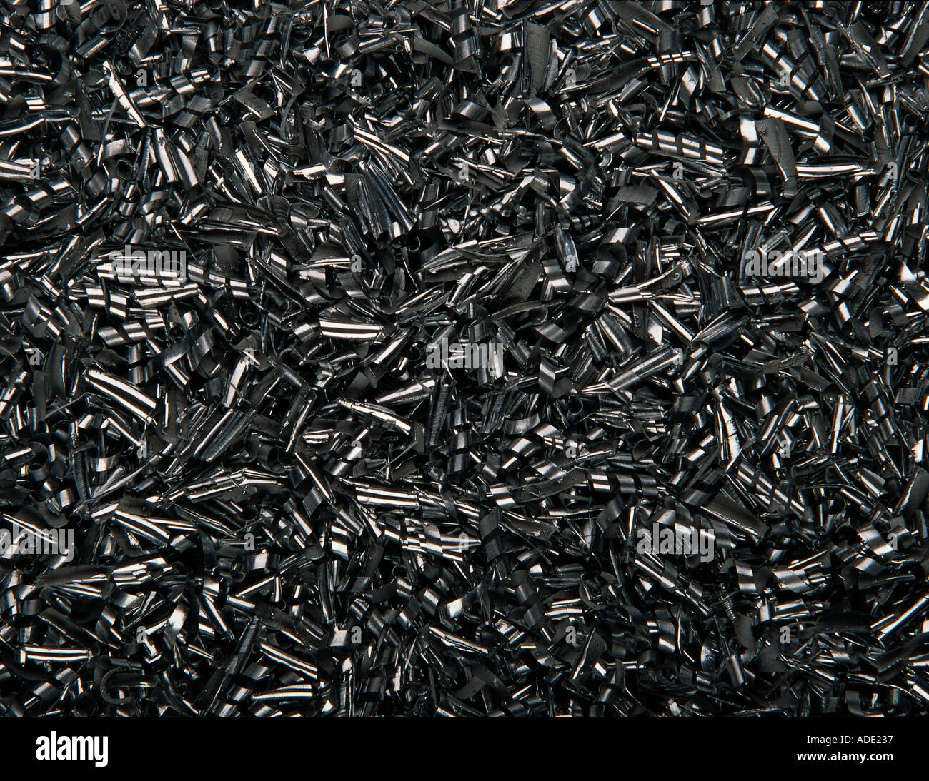 A random collage or background of shiny sharp silver colored metal ...