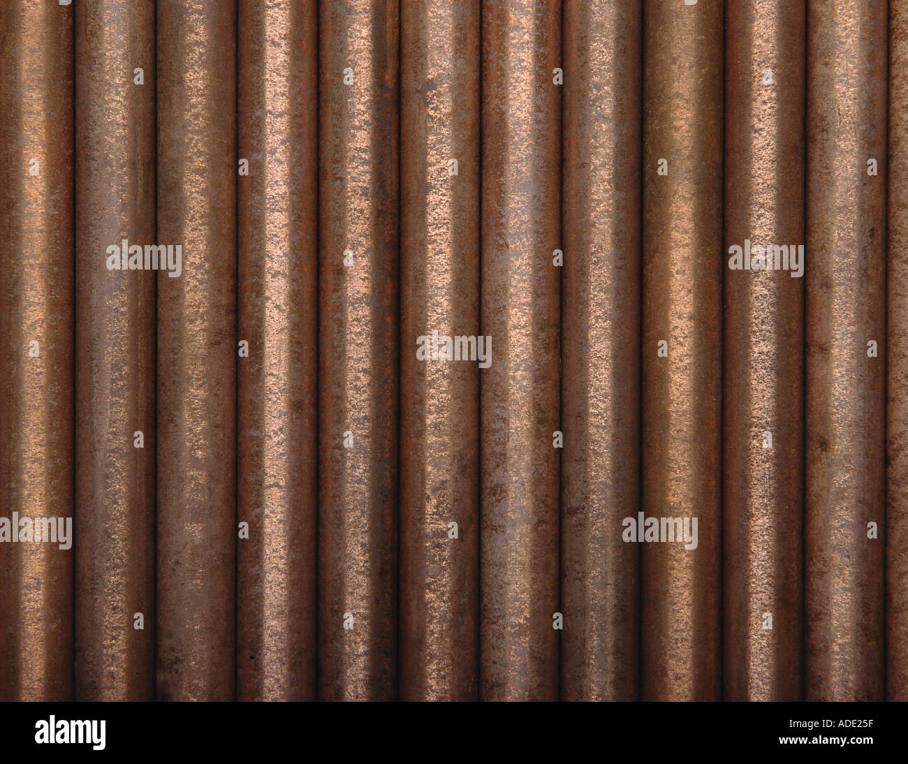 A close up of columns of copper colored metal pipes rods or tubes Stock ...