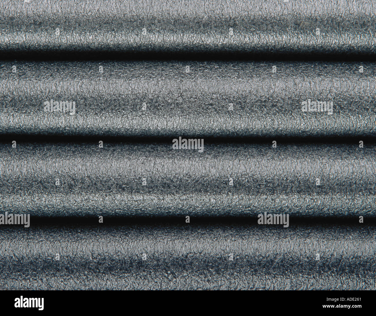 A close up of rows of gray foam insulating tubing Stock Photo - Alamy