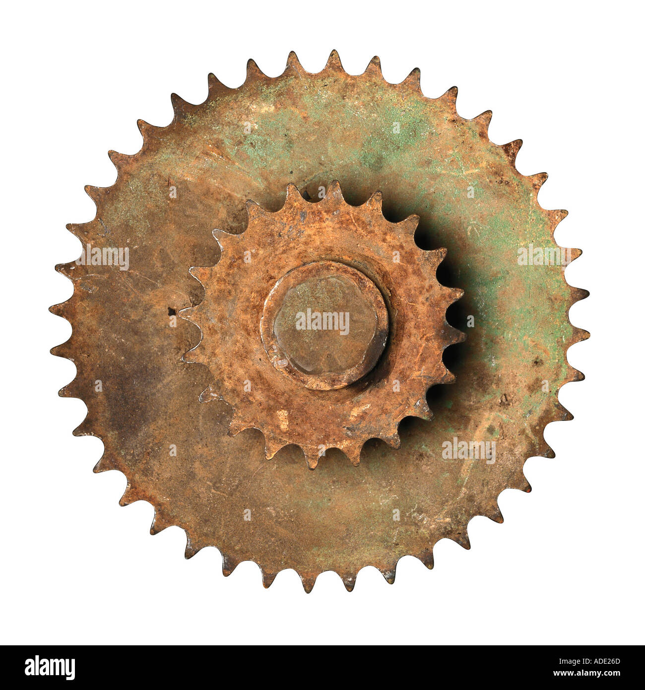 An old round rusted metal industrial gear with many teeth and a smaller ...