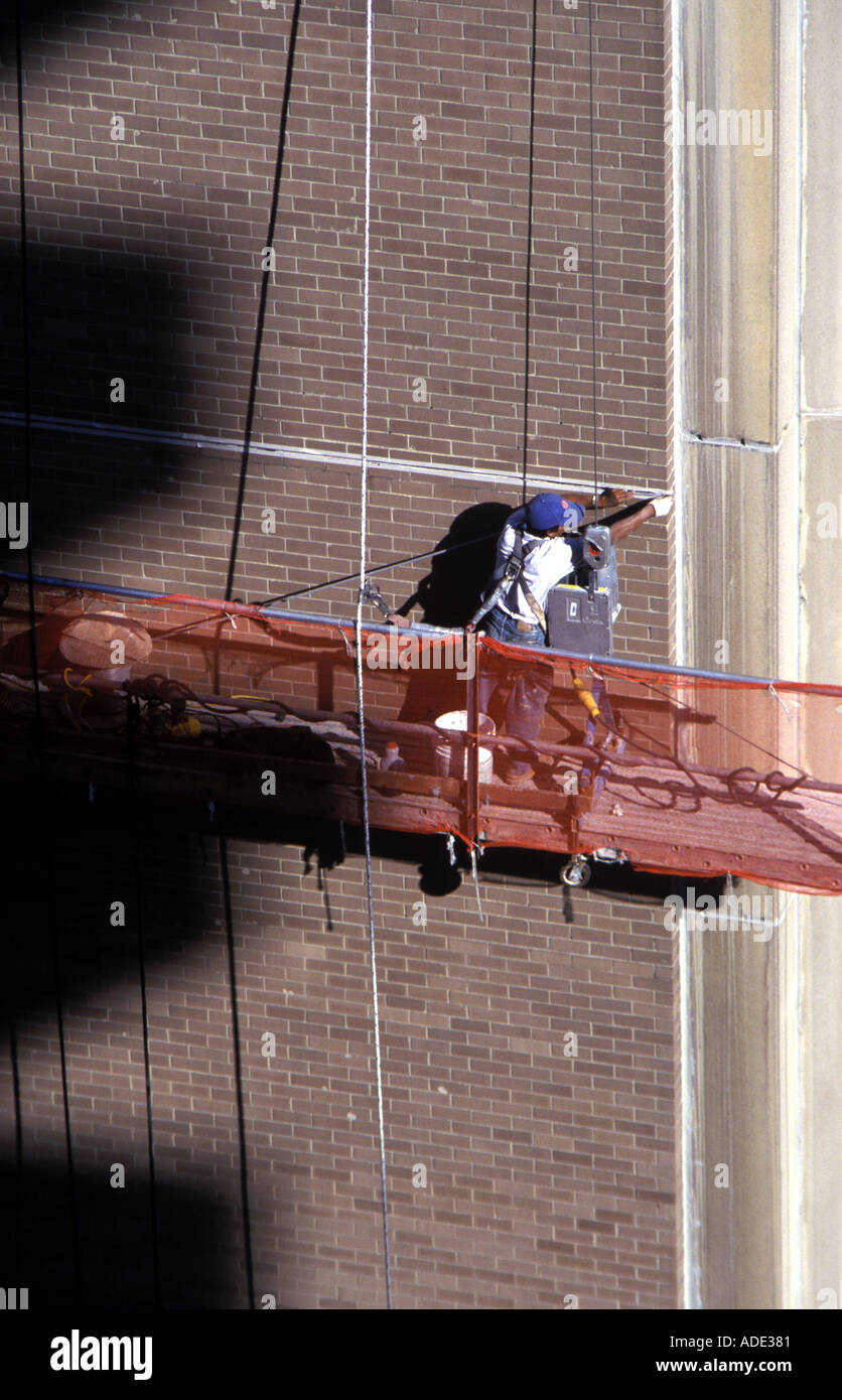 Worker on scaffolding Stock Photo - Alamy