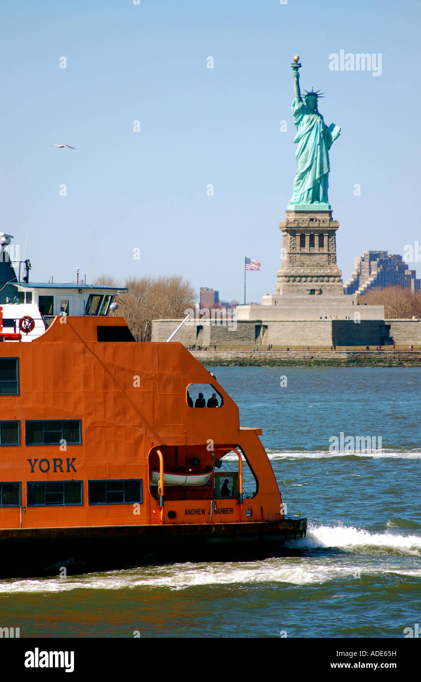 The staten island ferry passing the statue of liberty hi-res stock ...