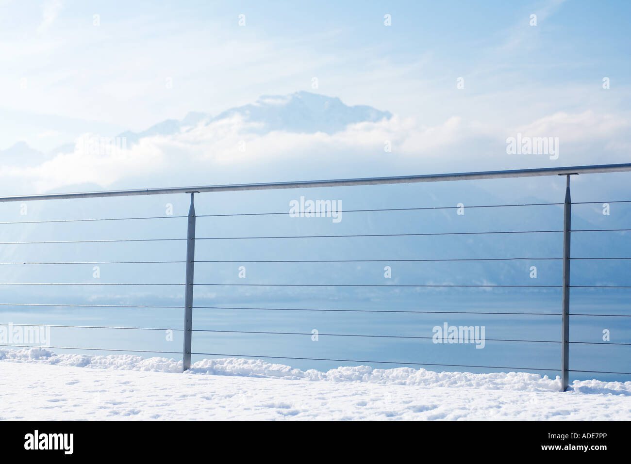 Snow-covered lookout area with lake and mountains Stock Photo - Alamy