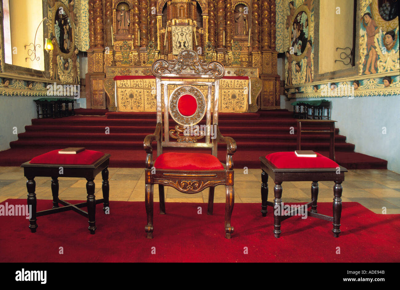 Celebrant chair and stools in front of altar of the chapel at Rachol ...