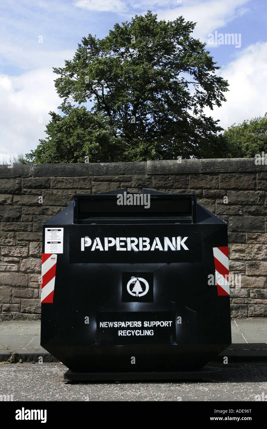 A PAPER RECYCLING BIN ON THE ROAD IN FRONT OF A TREE Stock Photo - Alamy