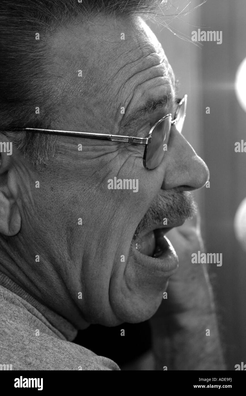 Profile Head Shot of man Shaving with an Electric razor Stock Photo - Alamy