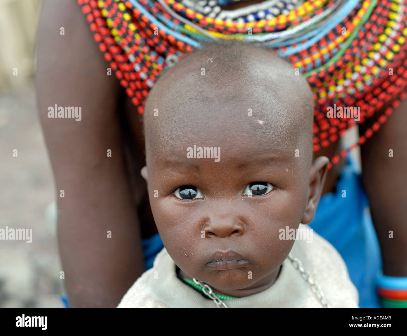 El Molo child with mother El Molo bay of Lake Turkana Northern Kenya ...