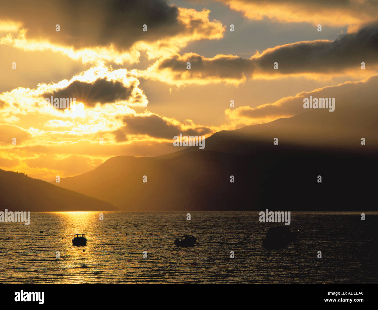 Beautiful honey coloured sunset seen over Loch Tay from Kenmore ...
