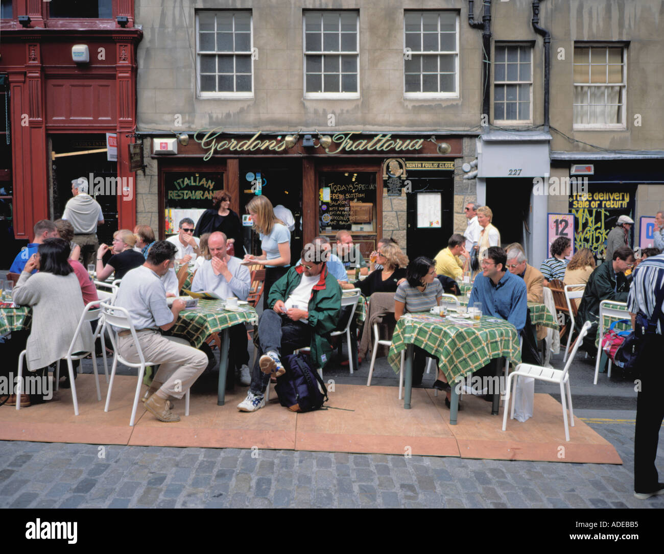 Many people sitting eating drinking dining hi-res stock photography and ...