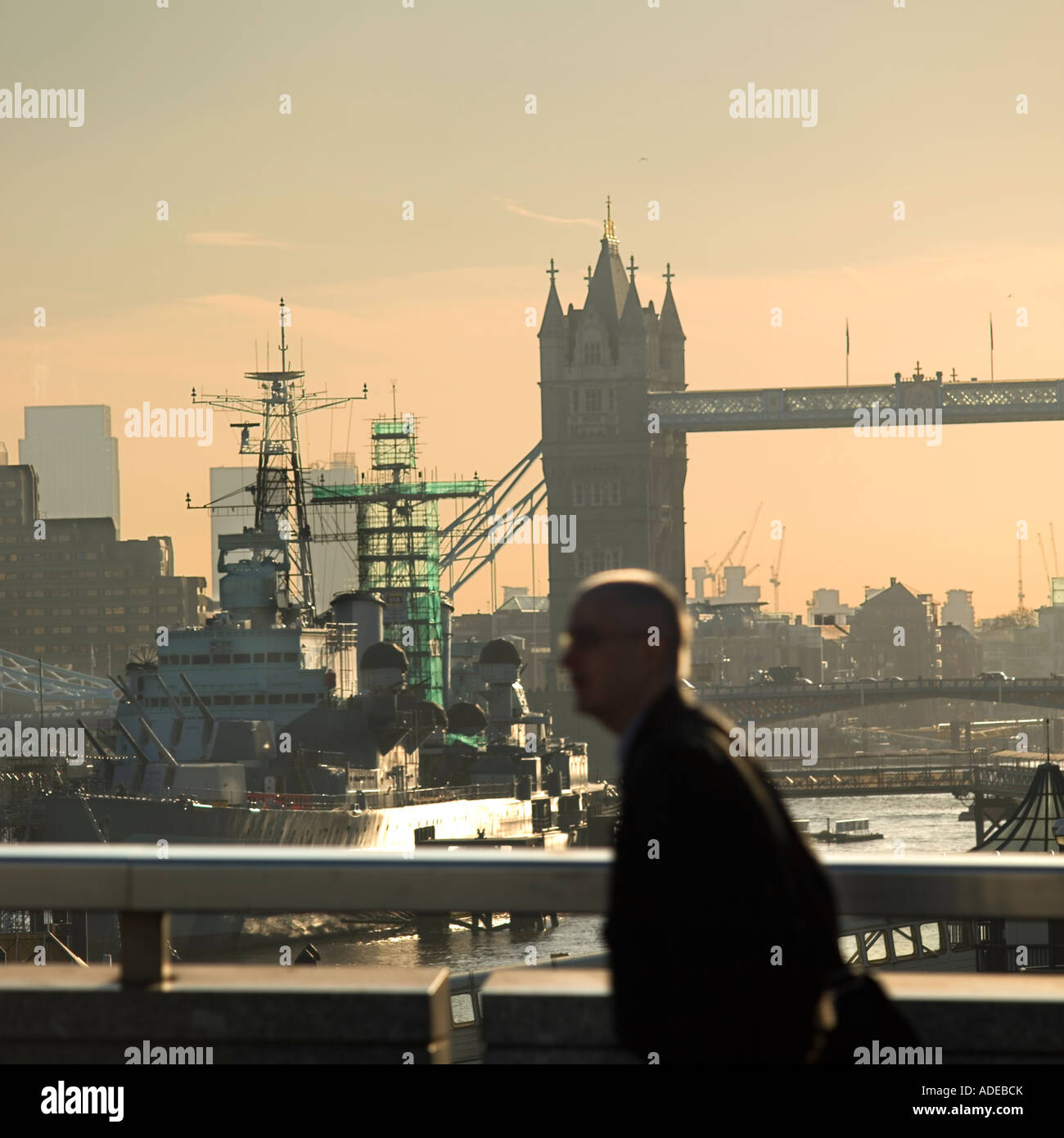 Going to work early morning office workers walking over London Bridge ...