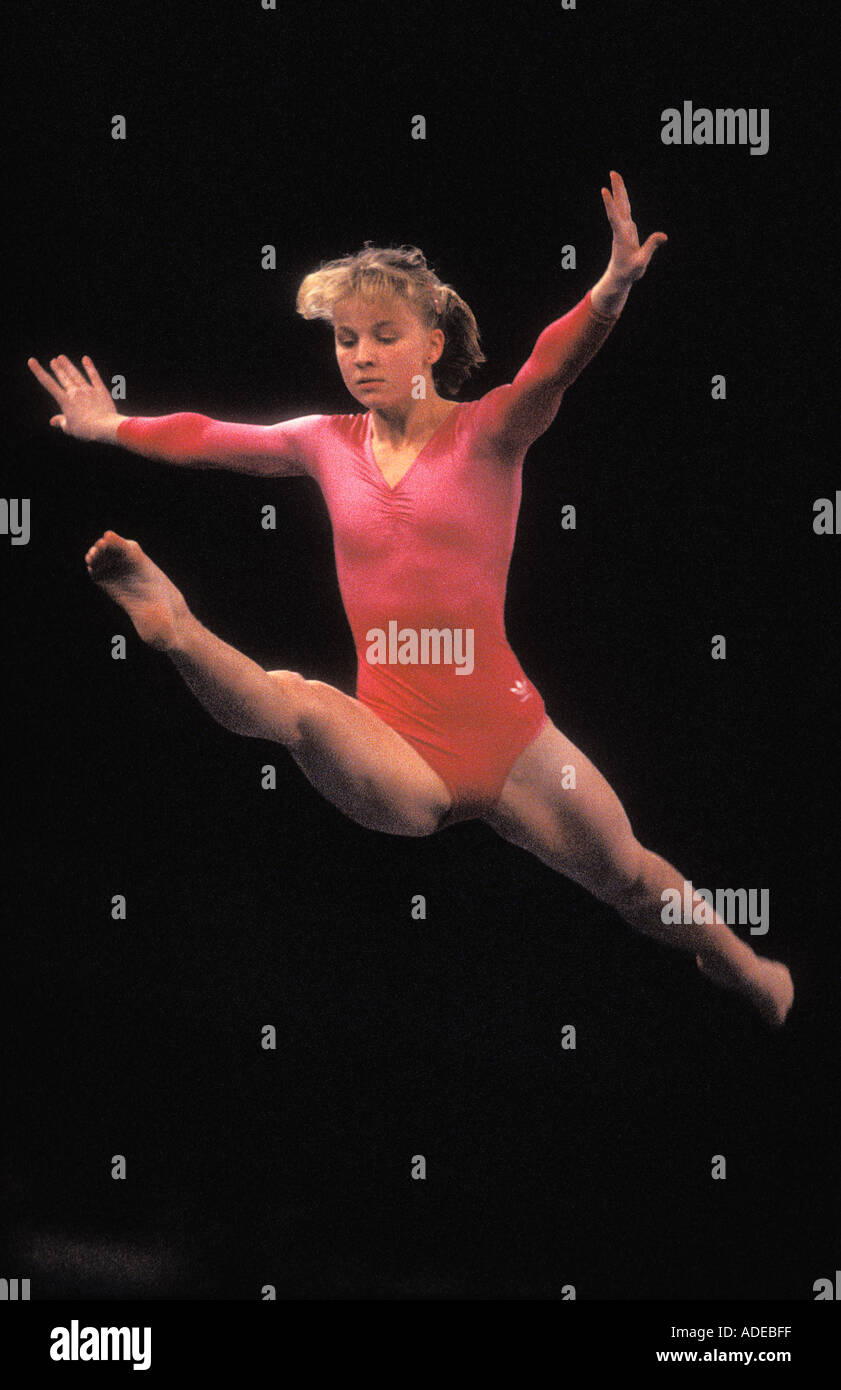 Gymnast jumping on beam hi-res stock photography and images - Alamy