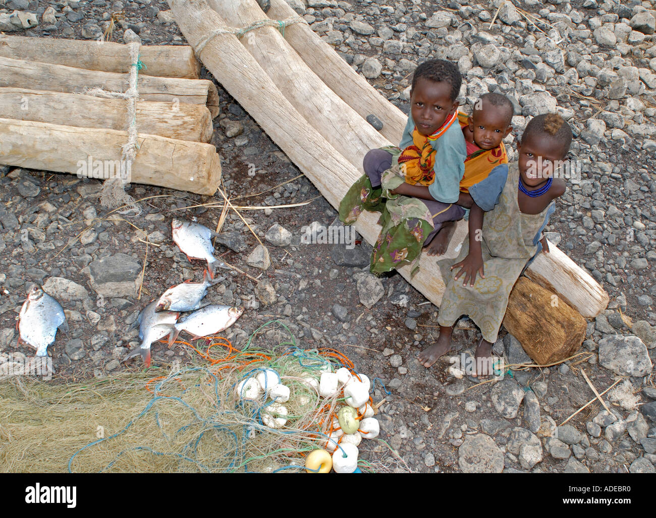 El Molo children with palm tree rafts and morning catch Lake Turkana ...
