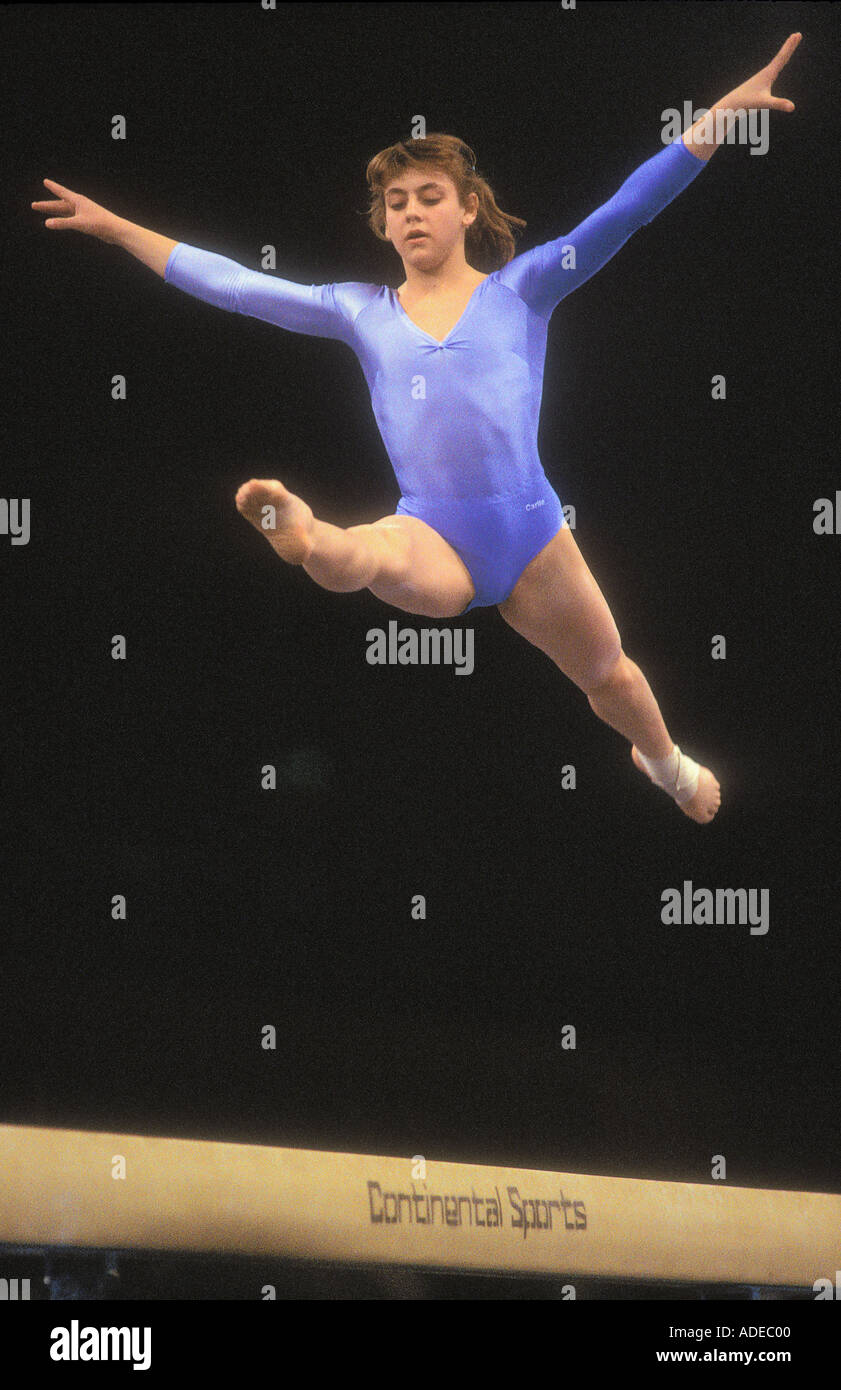 Gymnast jumping on beam hi-res stock photography and images - Alamy