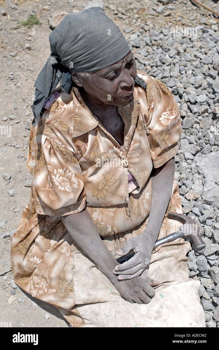 Old Kikuyu woman working hard in a stone quarry Kenya Stock Photo - Alamy