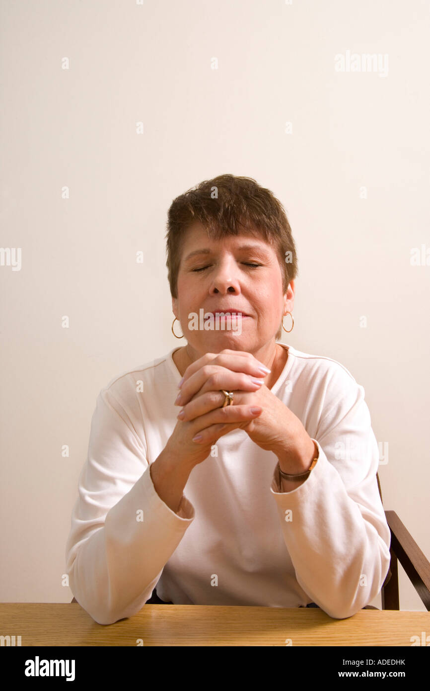 Praying woman prays, "Dear God Stock Photo - Alamy