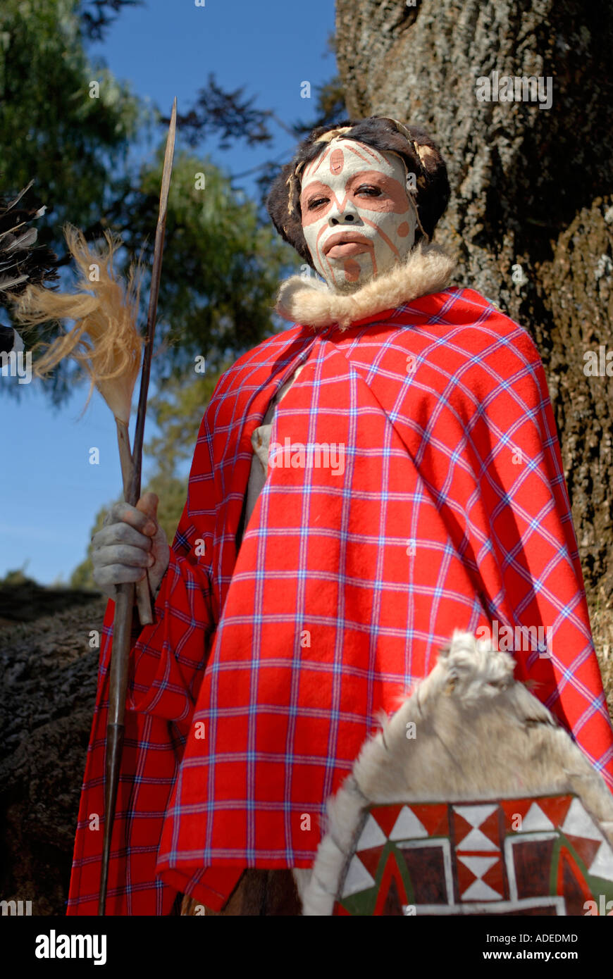Portrait of Kikuyu dancer in traditional costume of red blanket and ...