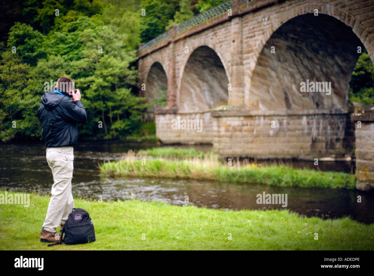 Photographer shooting a bridge Stock Photo - Alamy