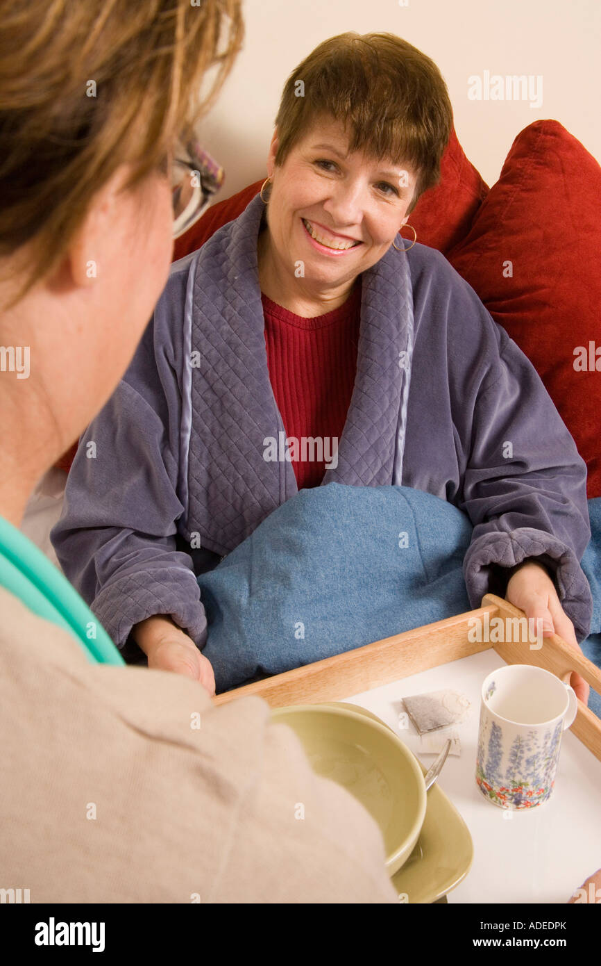 Nurse visits patient at home Stock Photo - Alamy