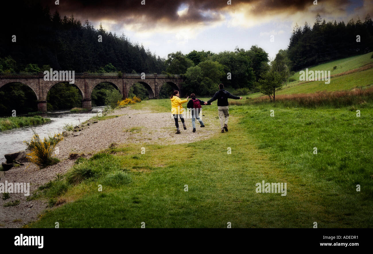 Hikers skipping along path Stock Photo - Alamy