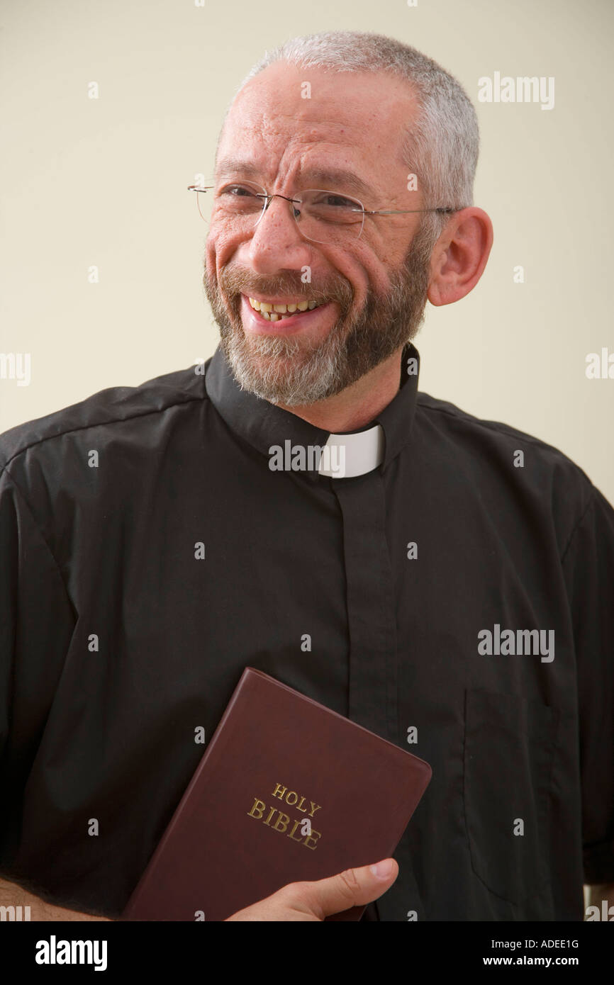 Religious man holds a Bible Stock Photo - Alamy