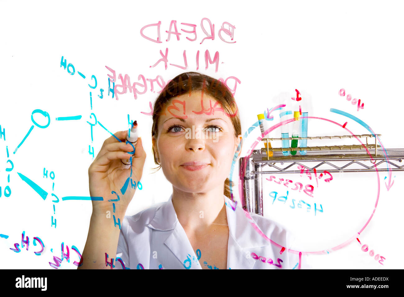 Lab worker writes info on wall Stock Photo - Alamy