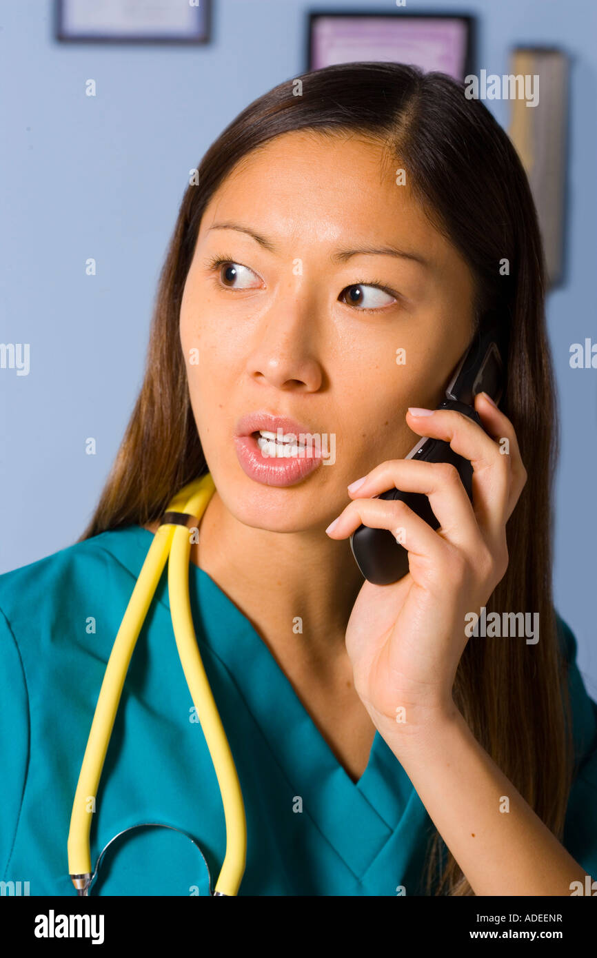Nurse checks up on a patient using her cell phone Stock Photo - Alamy