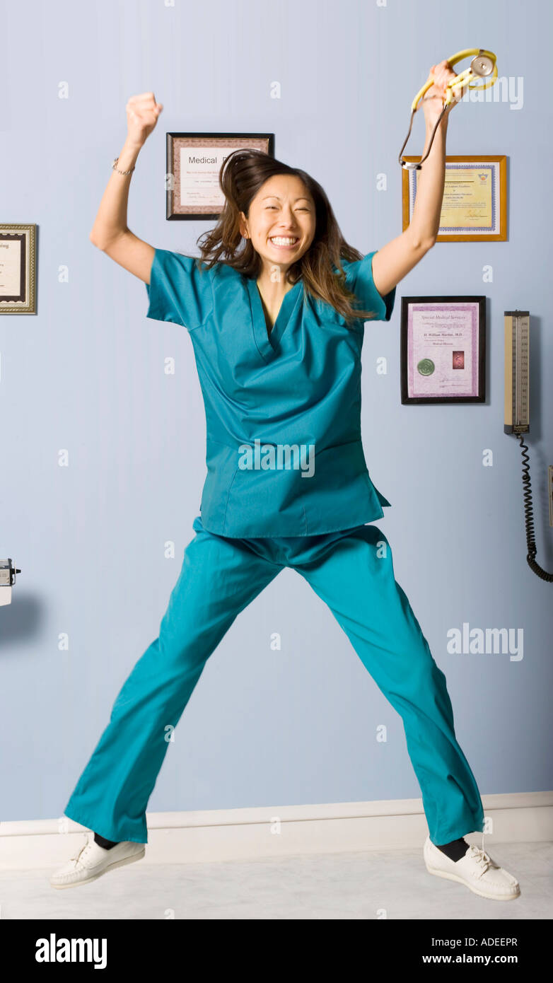 Nurse jumping for joy Stock Photo - Alamy
