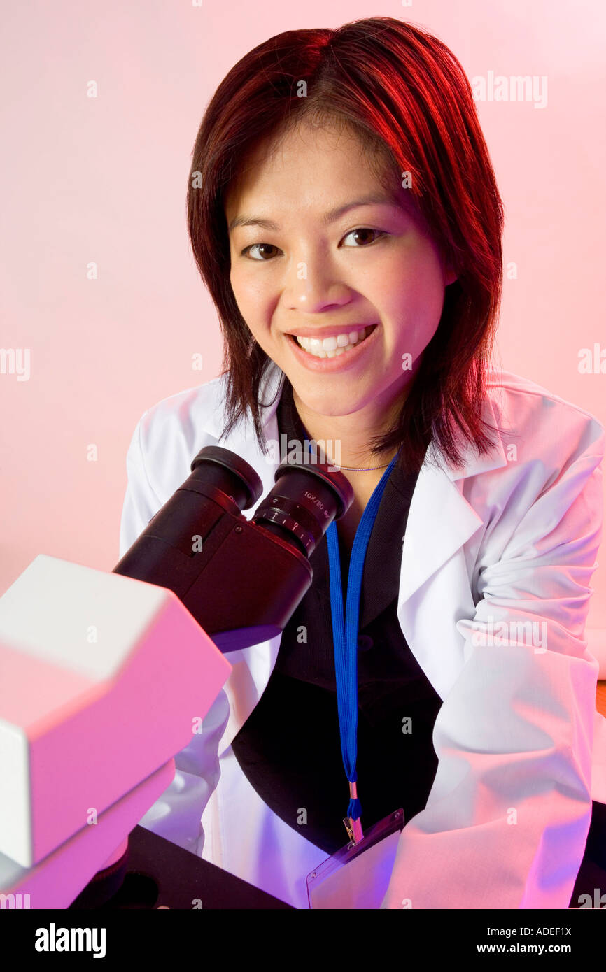 Researcher, microbiologist or pathologist uses a light microscope Stock ...