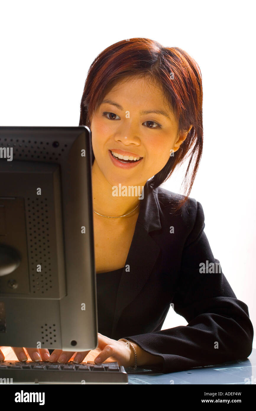 Woman surfing the Internet using a computer Stock Photo - Alamy