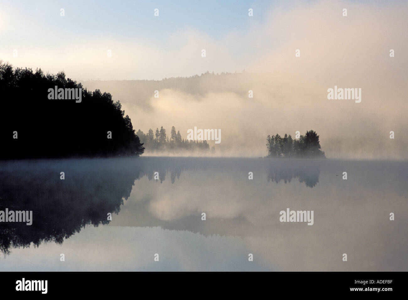 Fog lifting off lake hi-res stock photography and images - Alamy