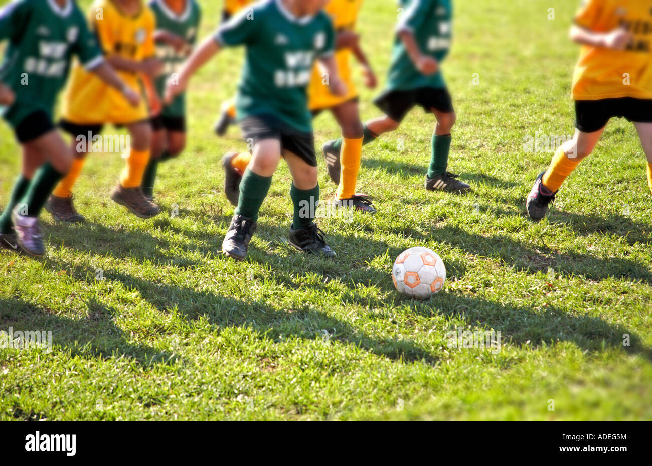 Boys playing soccer horizontal Stock Photo - Alamy