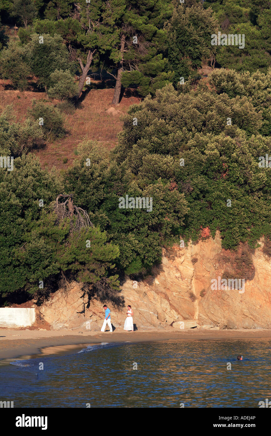 GREECE SPORADES SKIATHOS ISLAND A SMARTLY DRESSED COUPLE WALKING ALONG ...