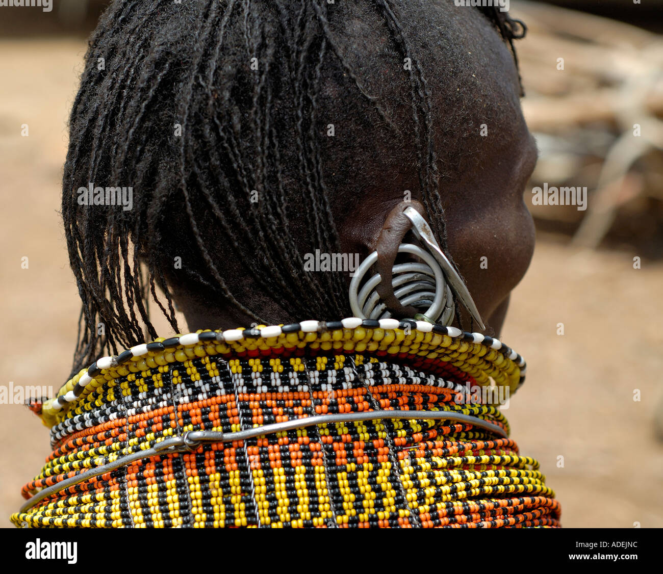 Close up of Turkana woman wearing typical tribal hairstyle and bead ...