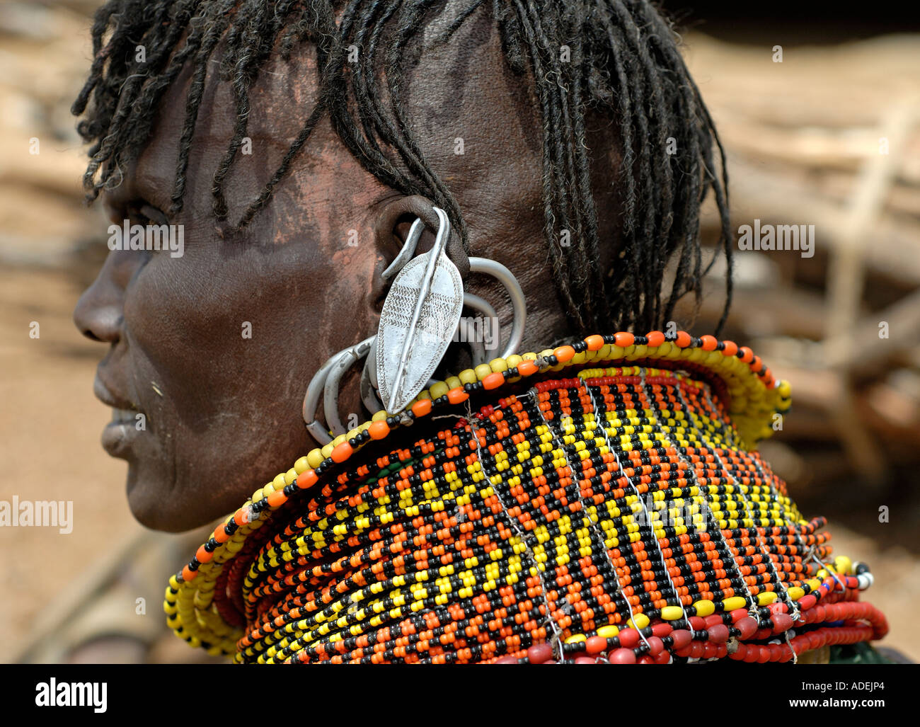 Close up of Turkana woman wearing typical tribal hair style and bead ...