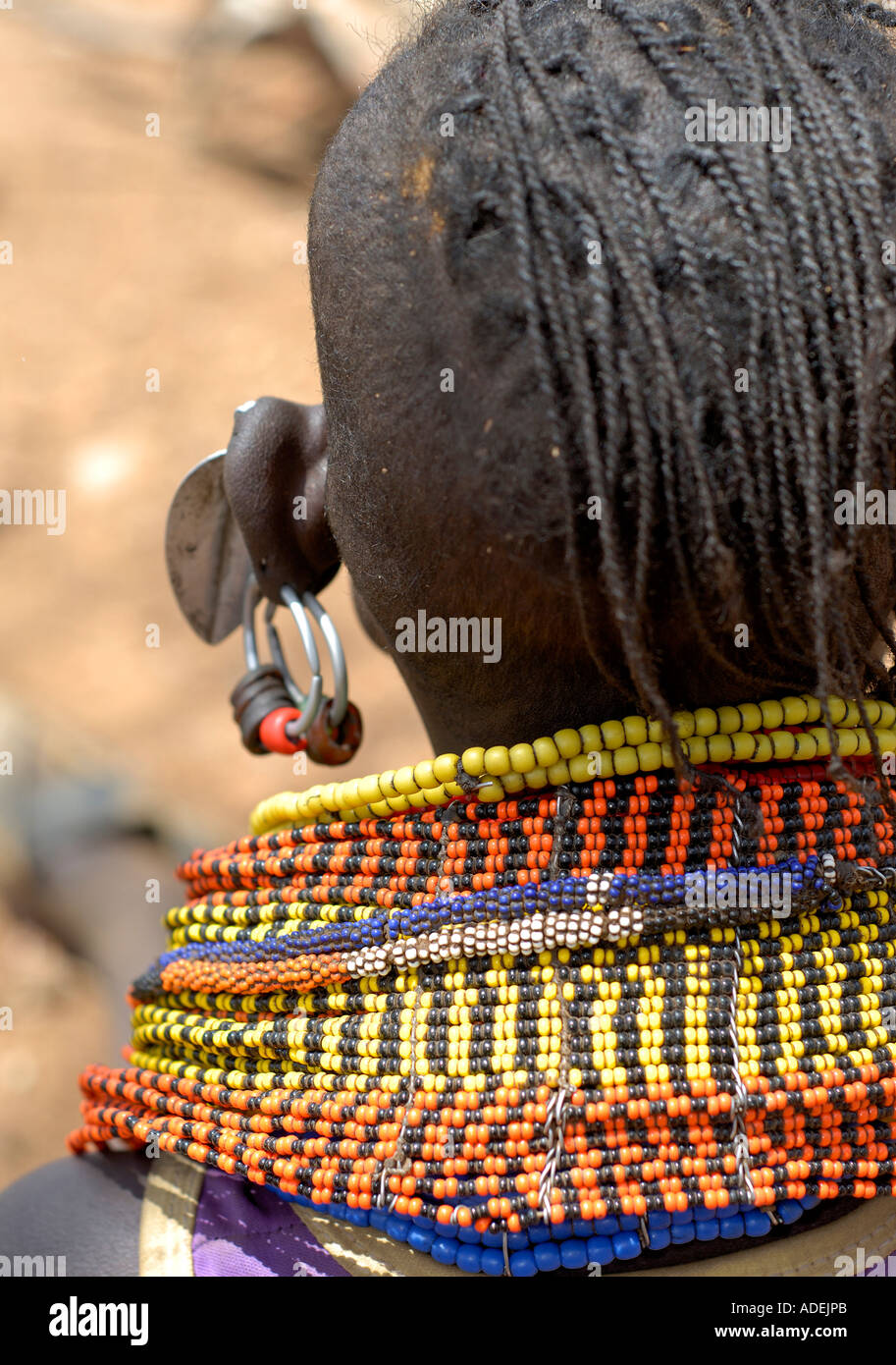 Close up of Turkana woman wearing typical tribal hairdressing and bead ...