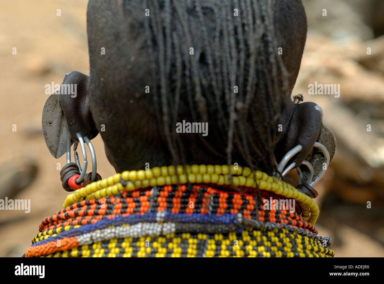 Turkana woman wearing typical tribal hairdressing and bead ornaments ...