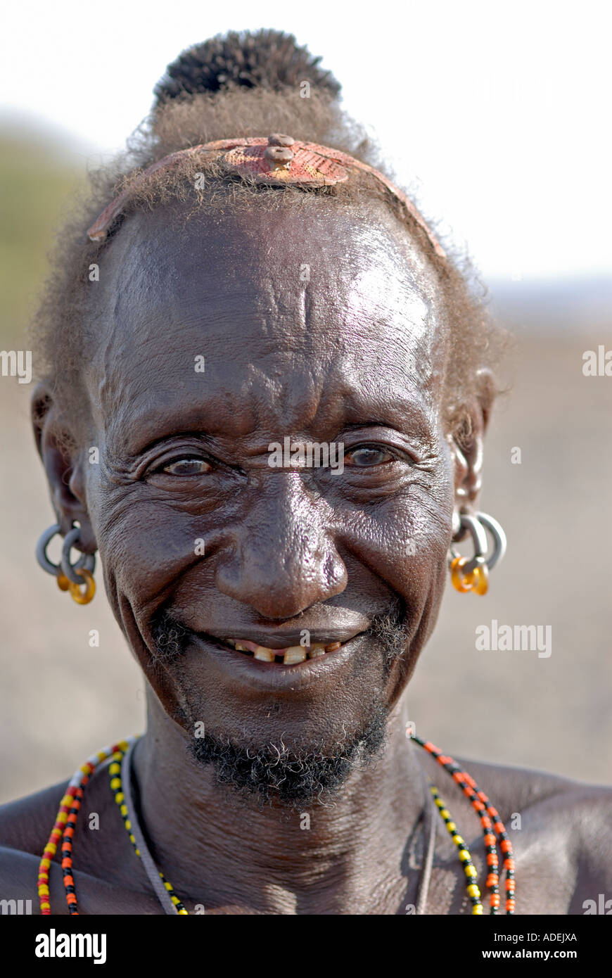 Turkana medicine man wearing clay hairdo and tribal decorations ...