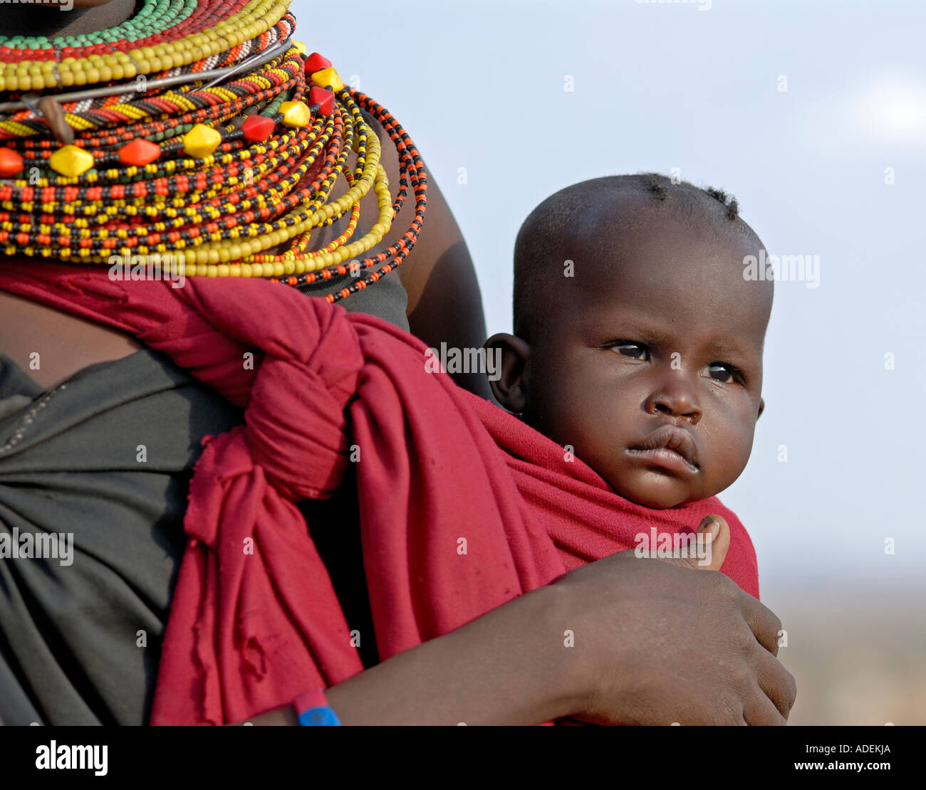Turkana tribeswoman carrying her child Northern Kenya Stock Photo - Alamy