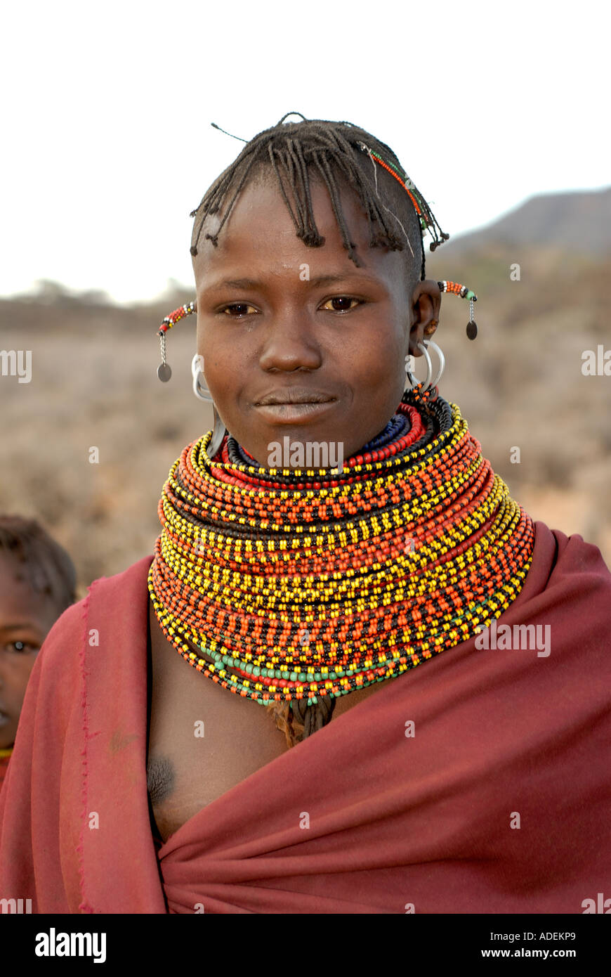 Turkana girl with traditional hairstyle and an abundance of bead ...