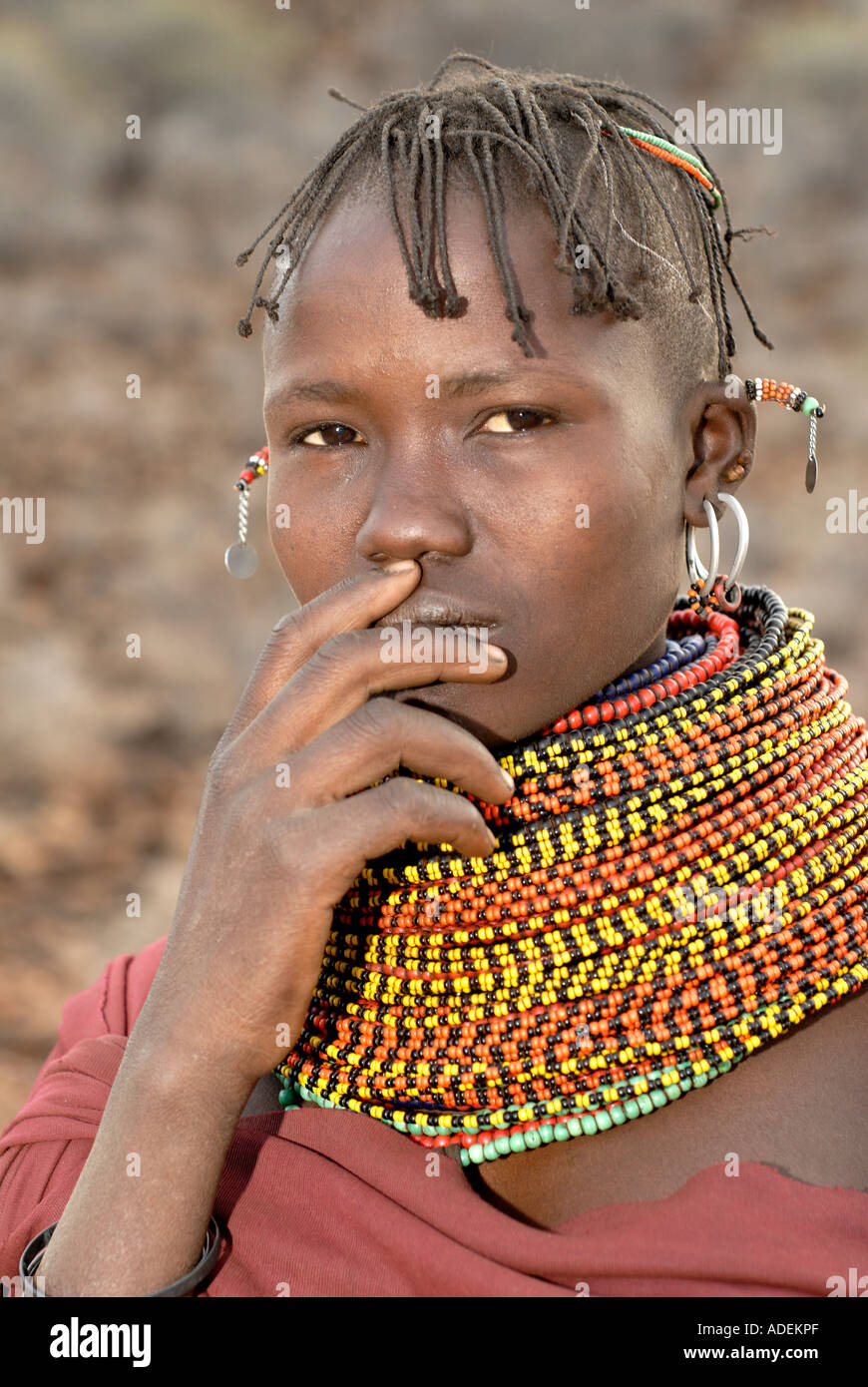Turkana girl with traditional hairstyle and an abundance of bead ...