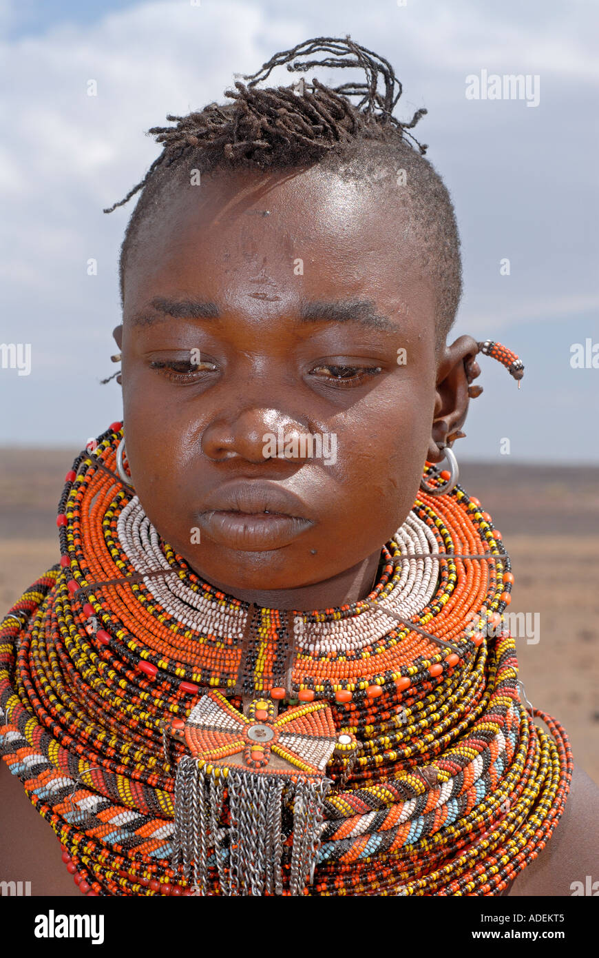 Turkana tribeswoman with traditional hairstyle and an abundance of bead ...
