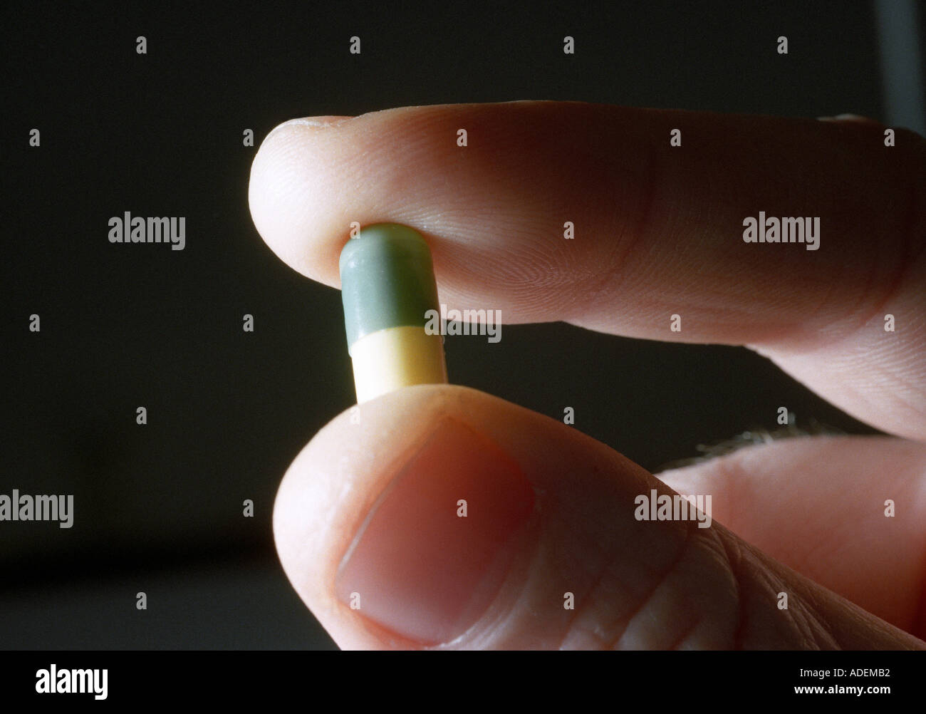 capsule between the fingers Stock Photo - Alamy